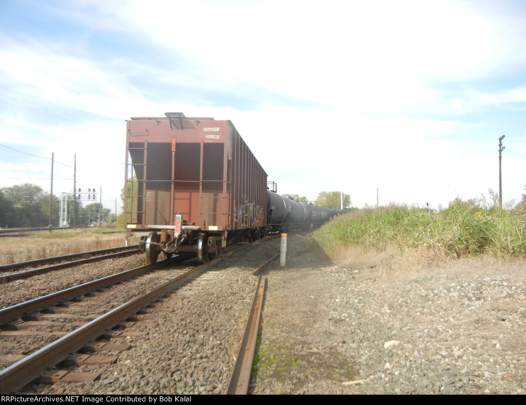 BNSF hopper brings up rear of Canadian Pacific 8862 & 8740 northbound tanker train